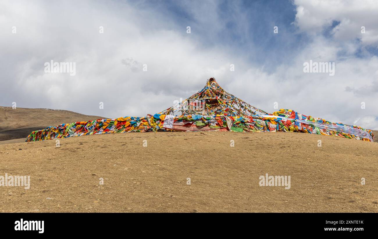 Multiple Tibetan religious prayer flags decorated and dressed a stupa ...