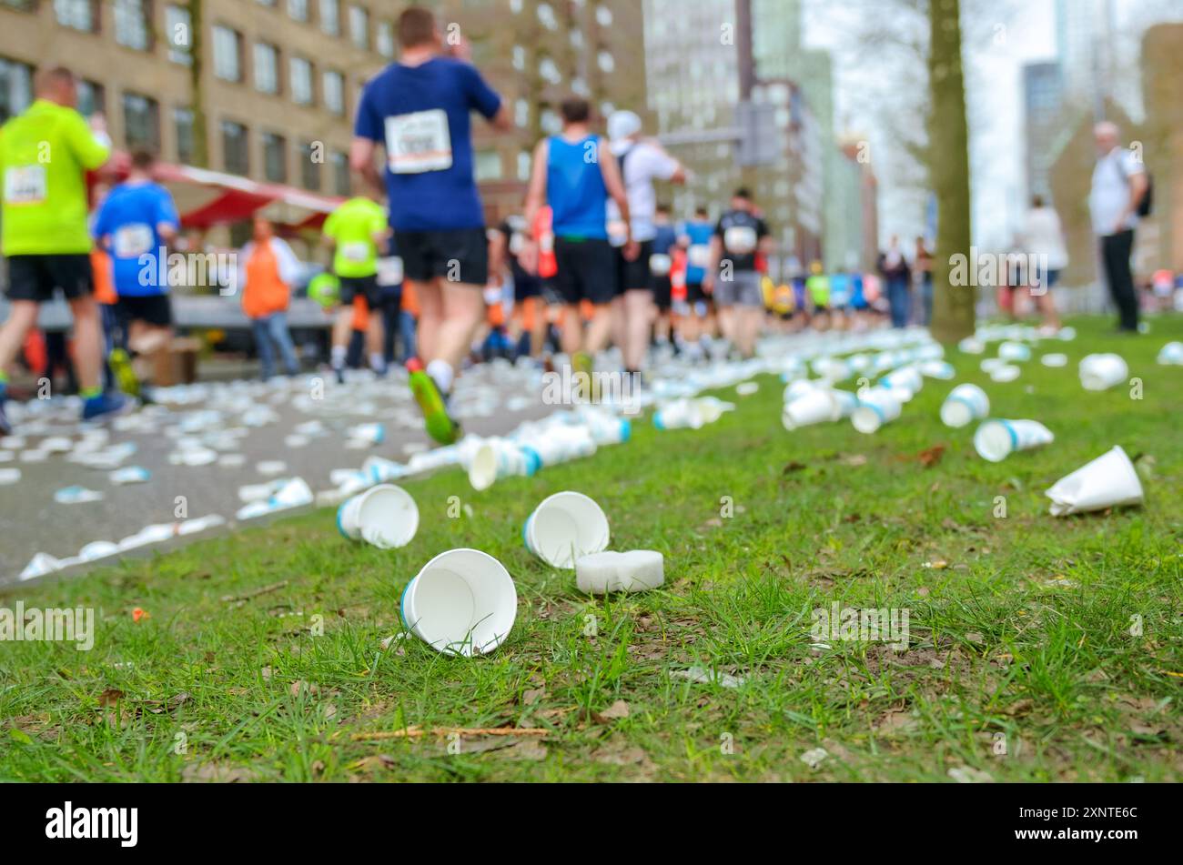Marathon running race, runners feet and plastic water cups on road near ...