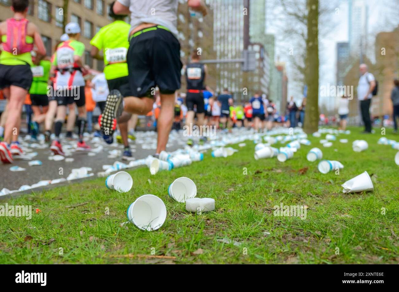 Marathon running race, runners feet and plastic water cups on road near ...