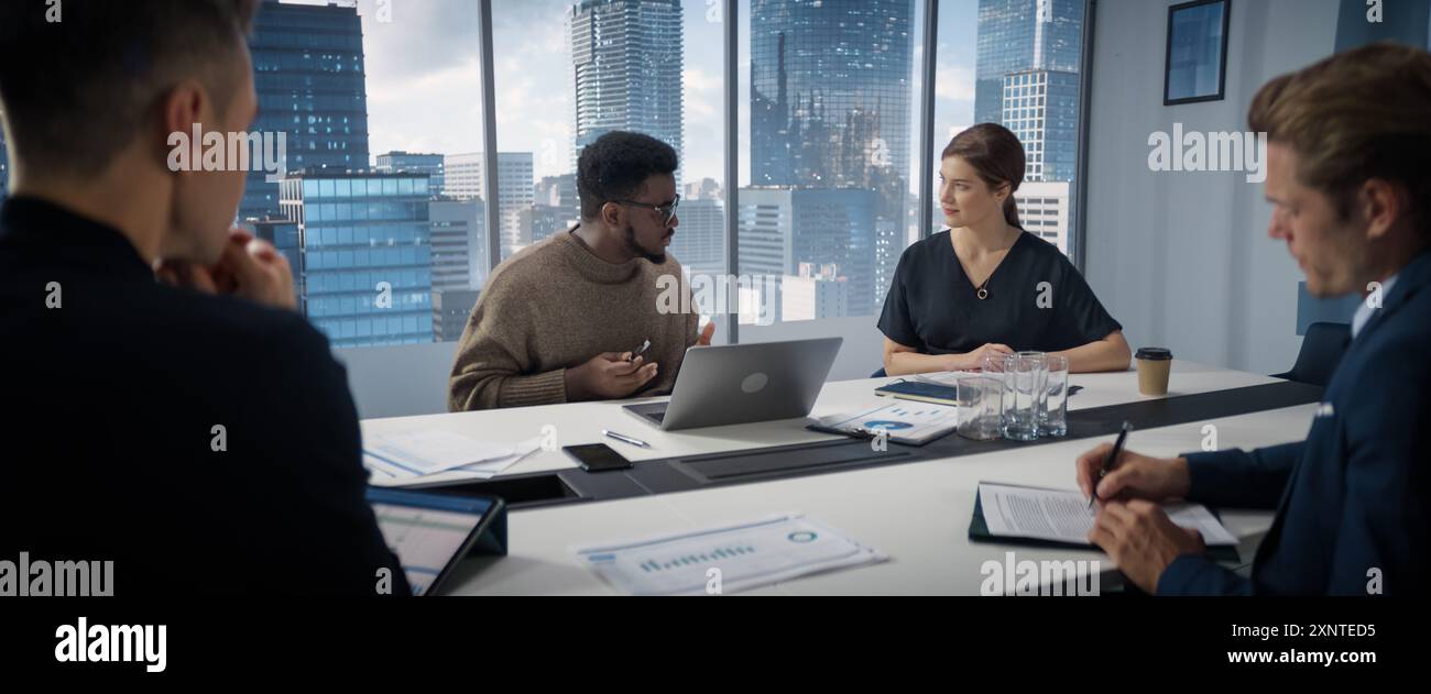 Meeting multi ethnic managers planning hi-res stock photography and ...