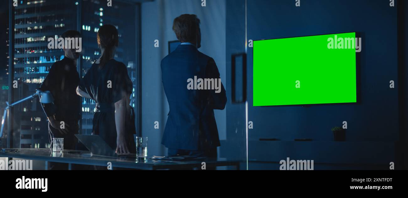 Modern Skyscraper Office Late At Night: Male And Female Caucasian ...