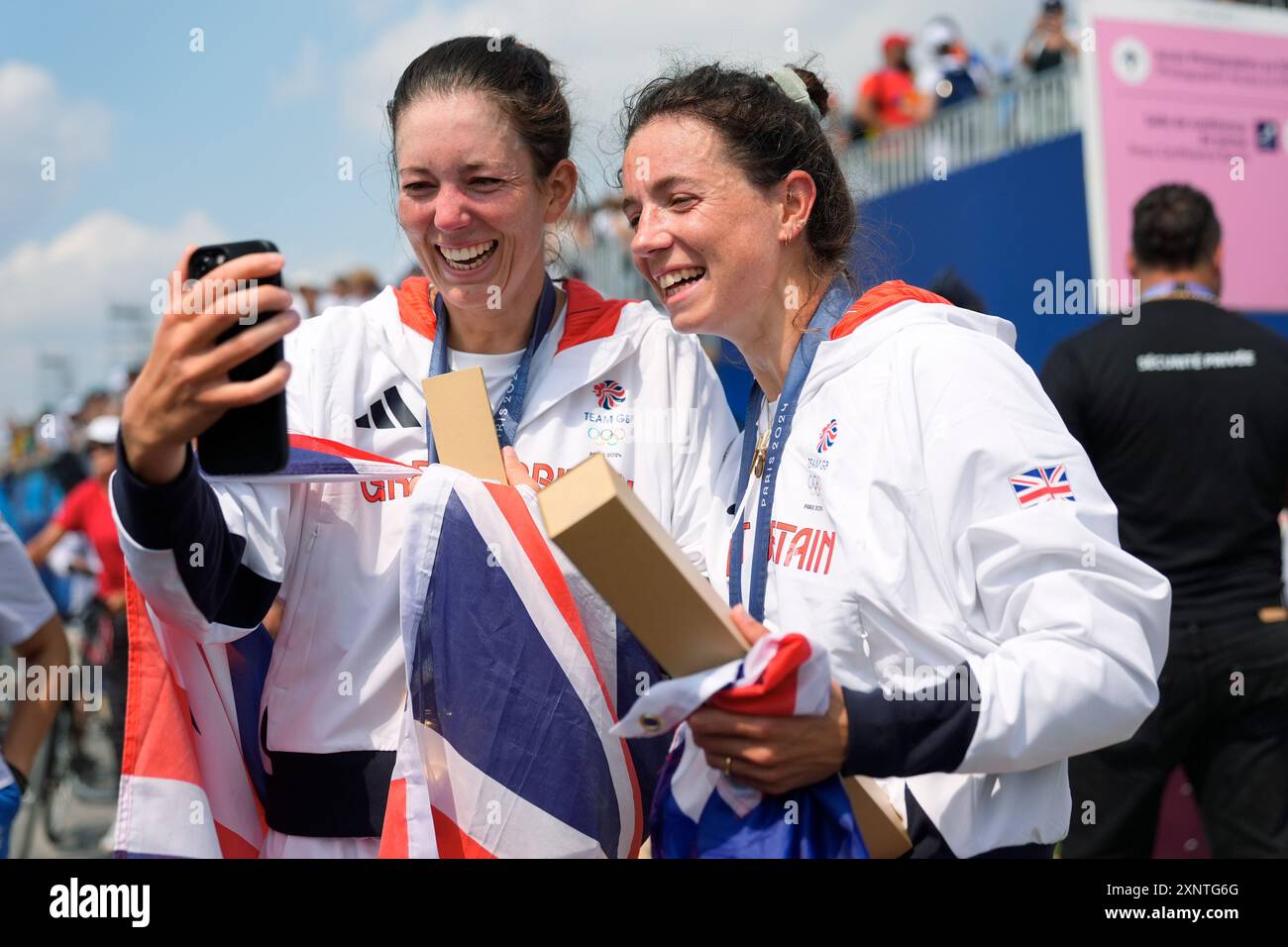 Britain's Emily Craig and Imogen Grant talk on the phone after they won ...