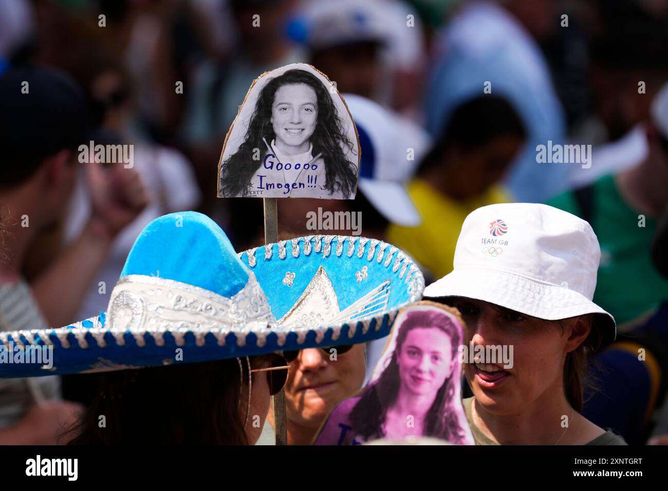 A fan holds a placard with the image of Britain's Imogen Grant who ...
