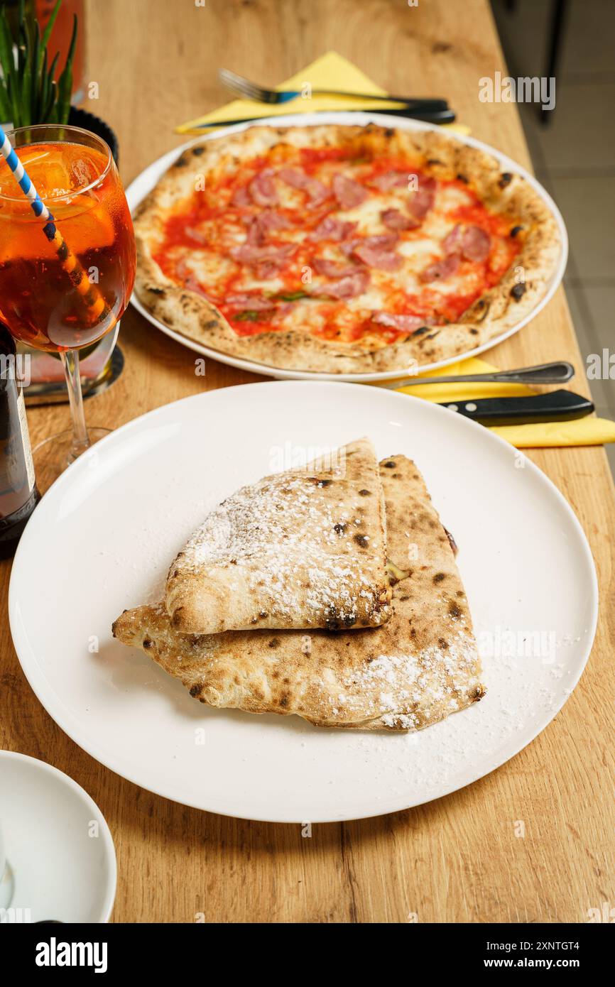 Italian dessert - calzone filled with chocolate, banana and powdered ...