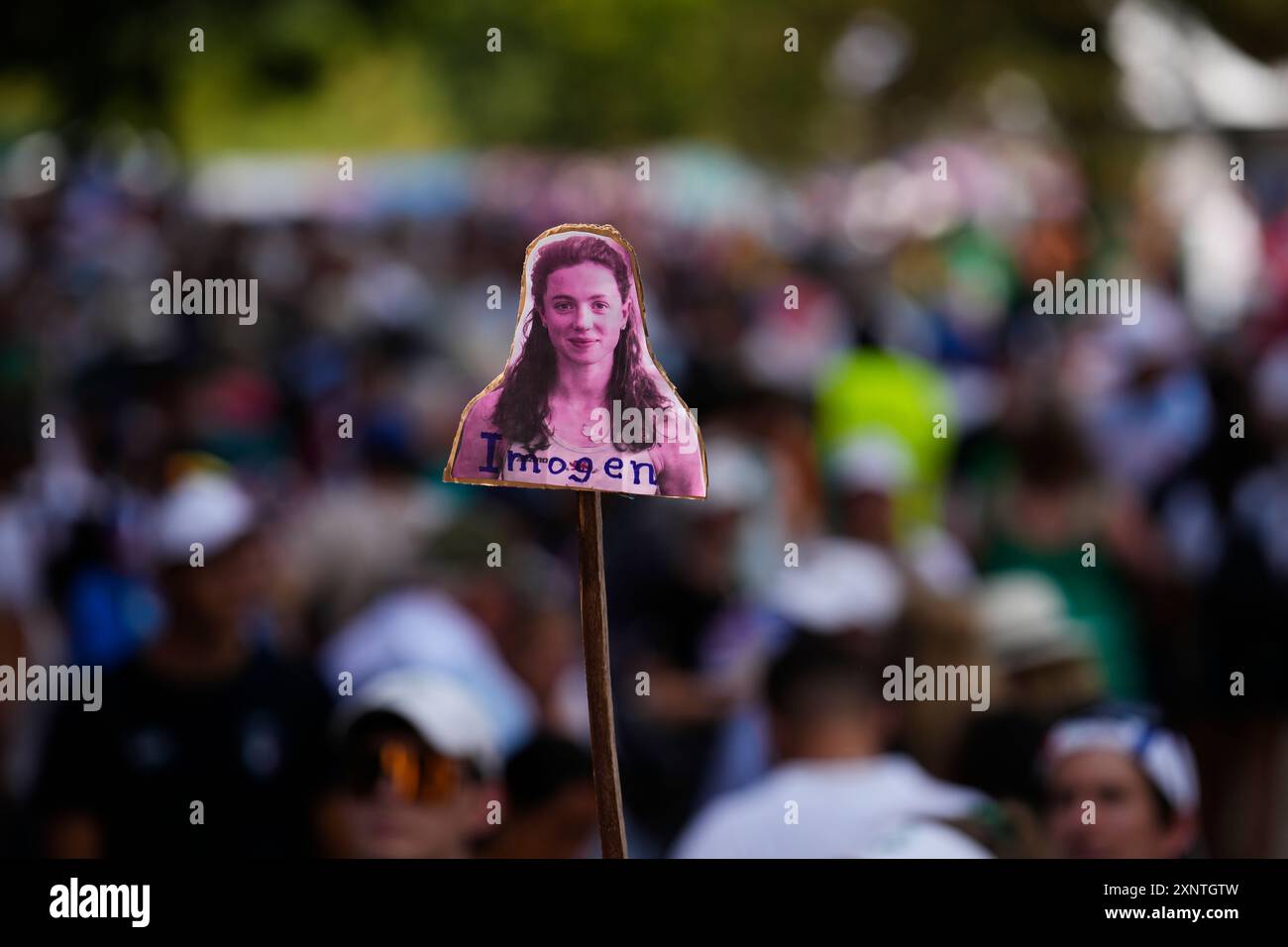 A fan holds a placard with the image of Britain's Imogen Grant who ...