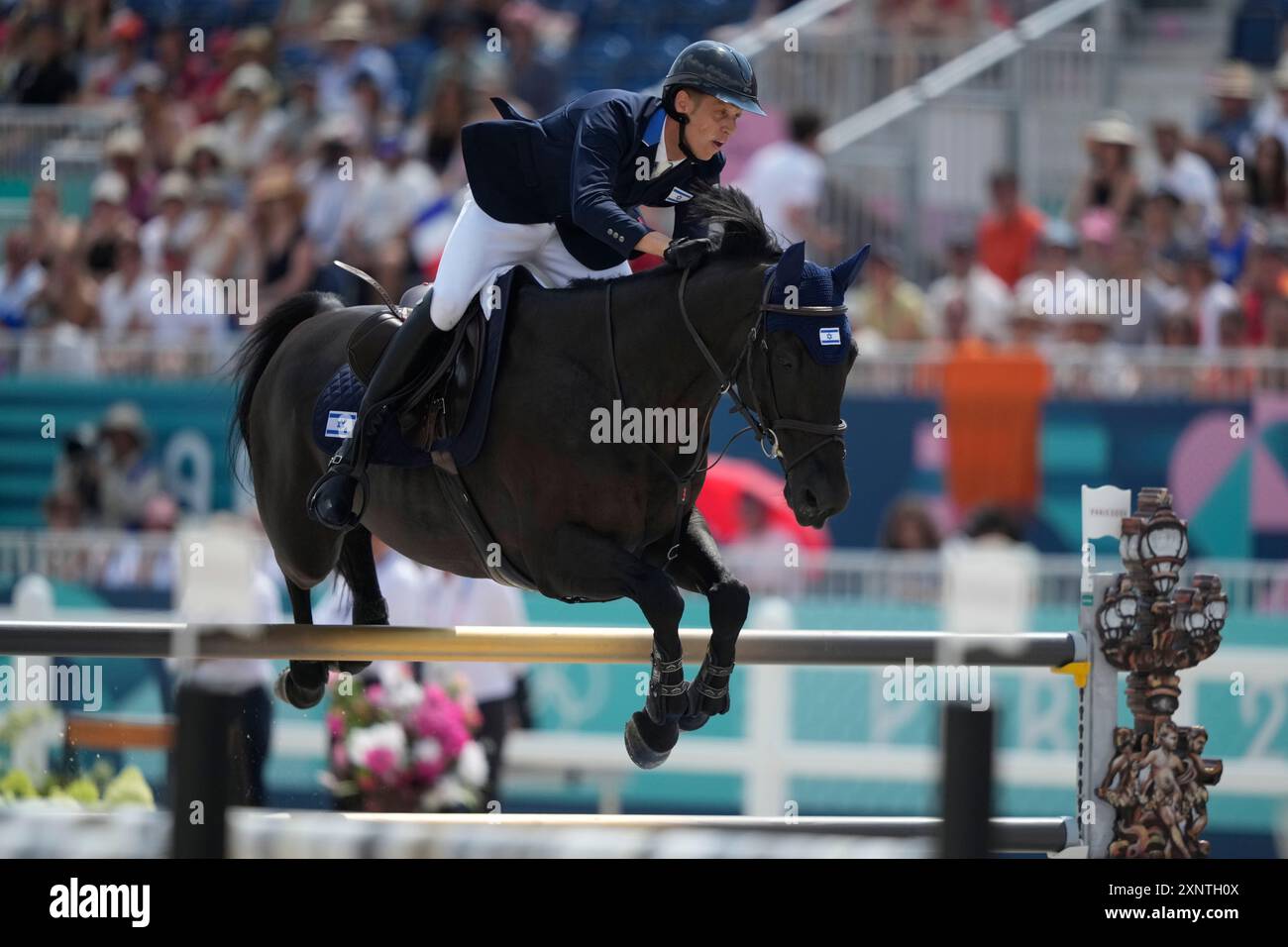 Israel's Robin Muhr riding Galaxy HM clears a hurdle during the ...