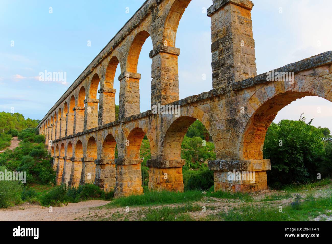 Dramatic capture of the elegant arches of the ancient Roman aqueduct ...