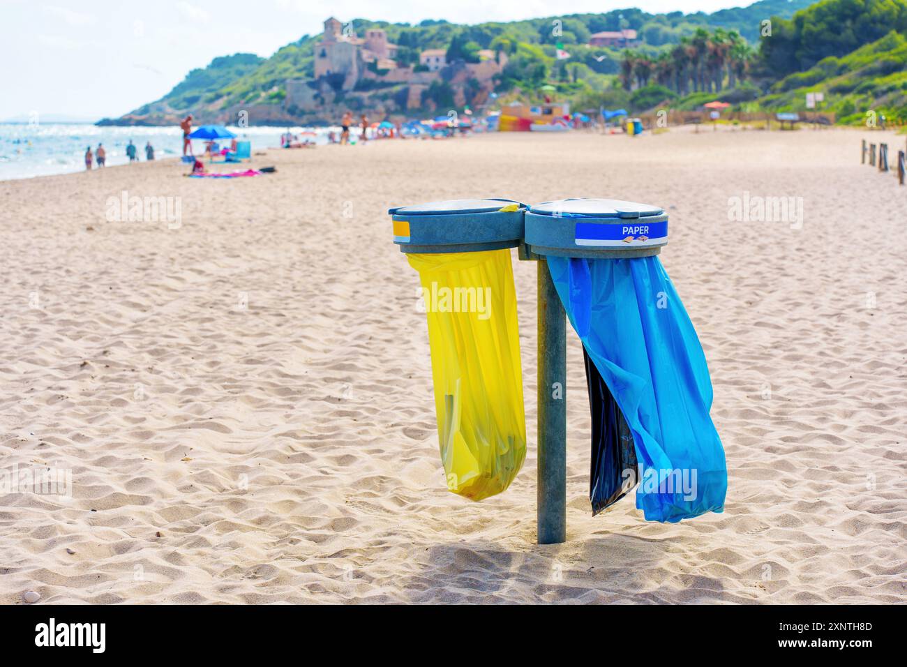 Color-coded trash bins for waste segregation on the Tarragona beach ...