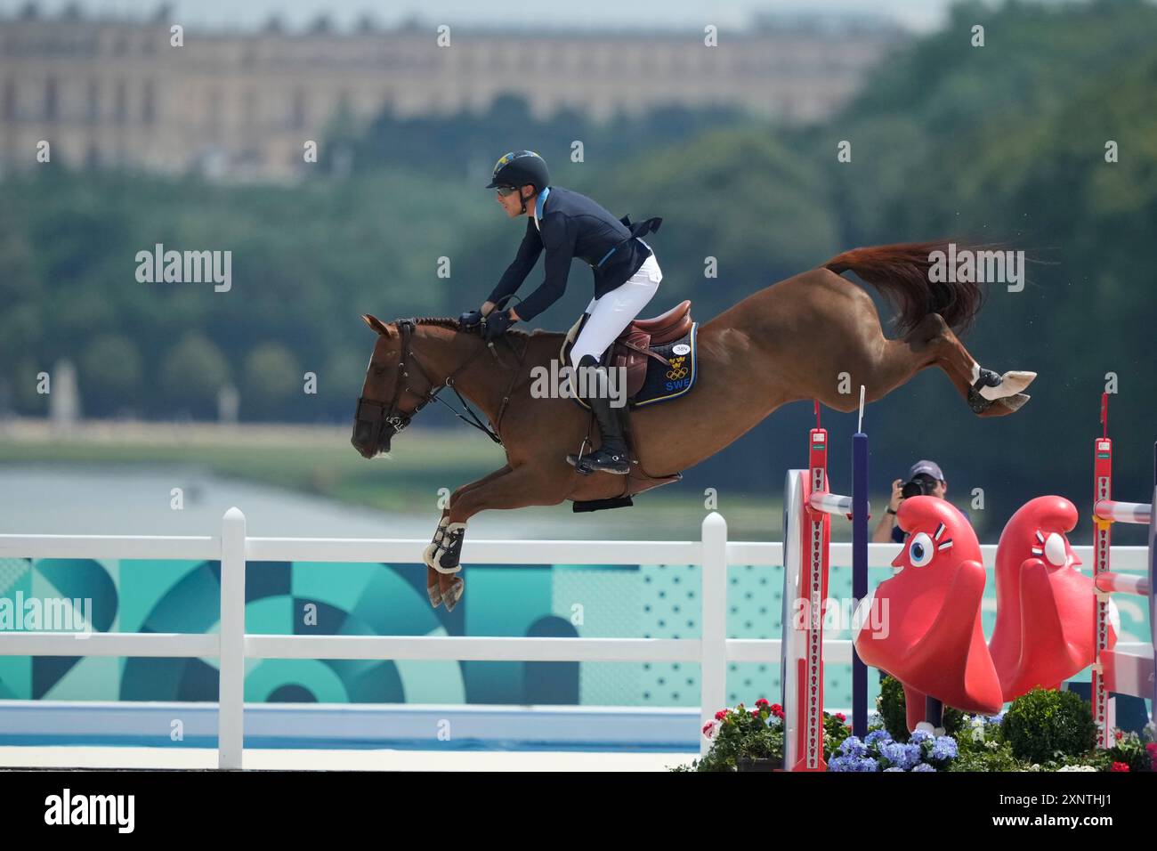 Sweden's Henrik von Eckermann riding King Edward clears a hurdle during ...