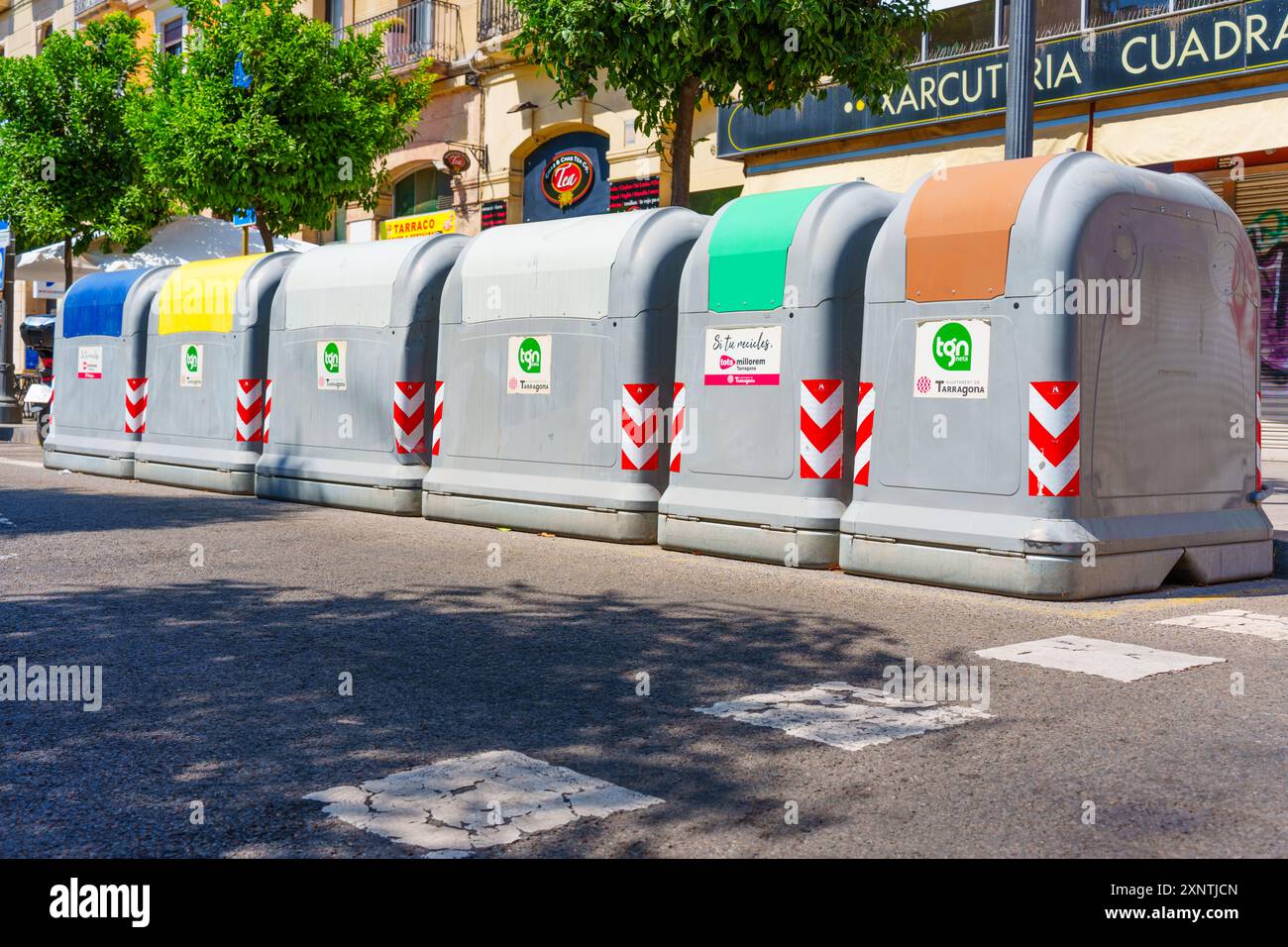 Tarragona, Spain - July 15, 2024: Recycling bins along a street ...