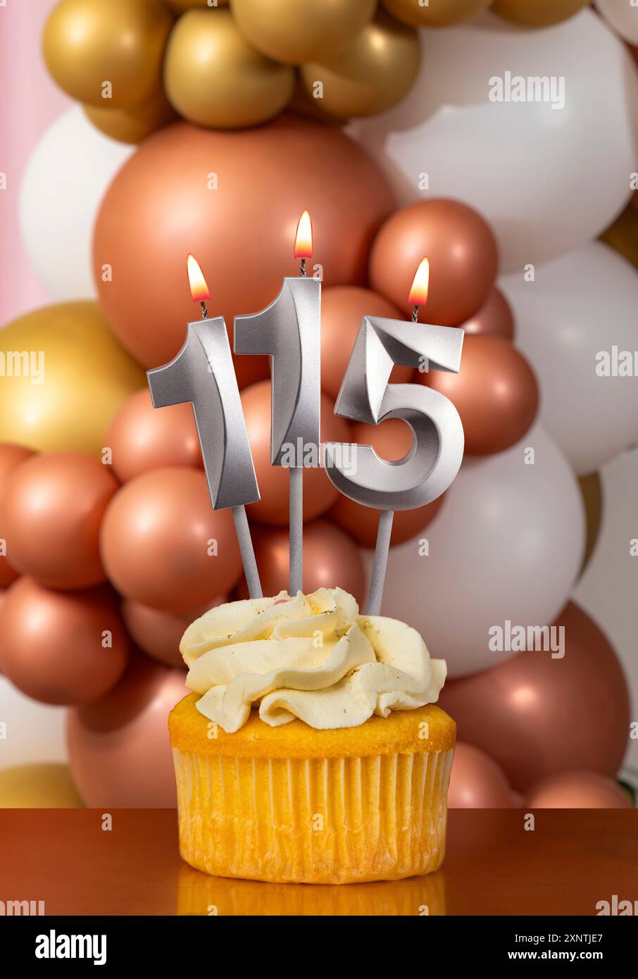 Cupcake with birthday candle on balloons background - Number 115 Stock ...
