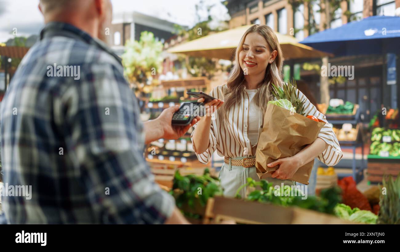 Modern Female Shopper Using Smartphone with Contactless Payment ...