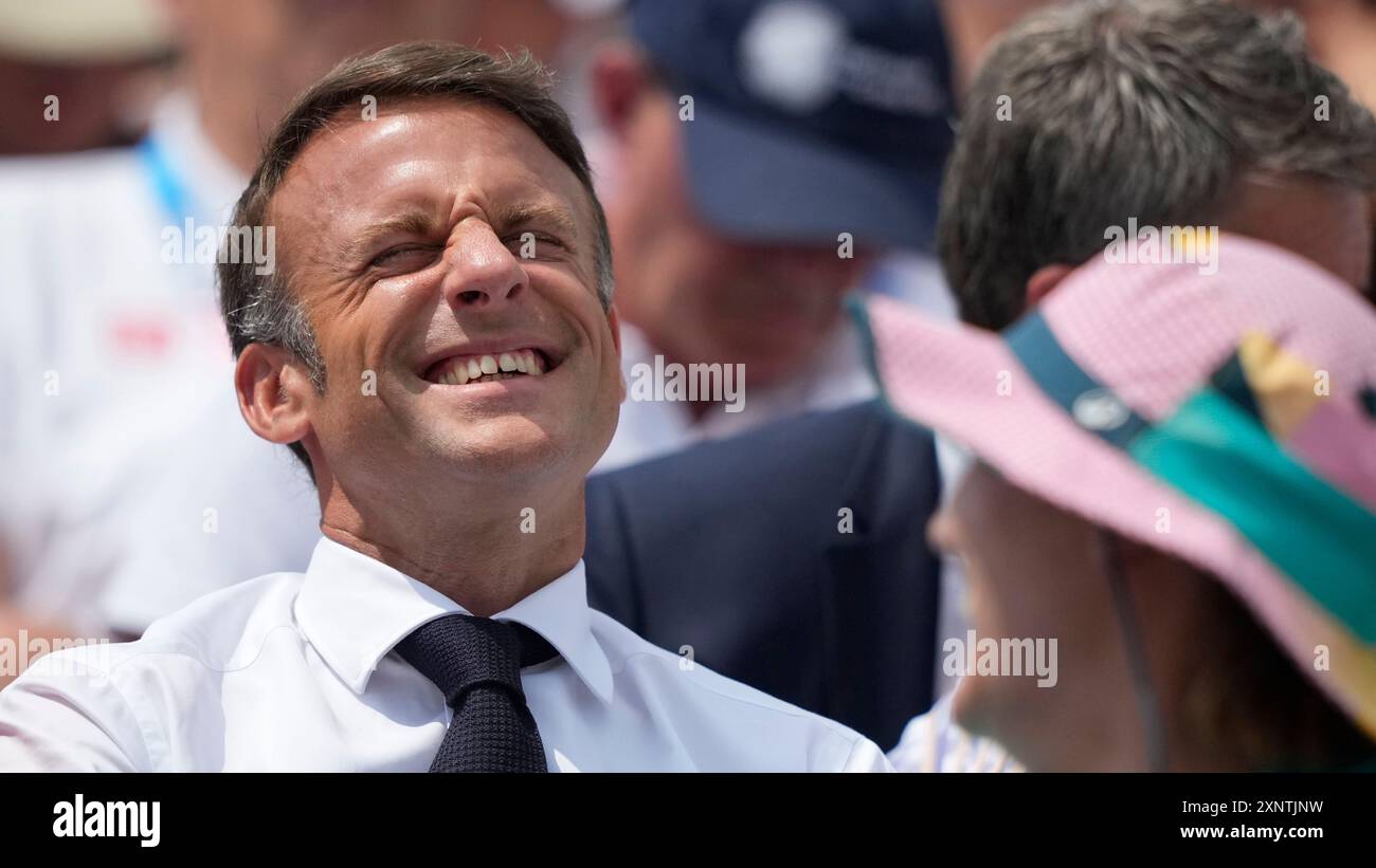 French President Emmanuel Macron watches the Equestrian Jumping Team ...