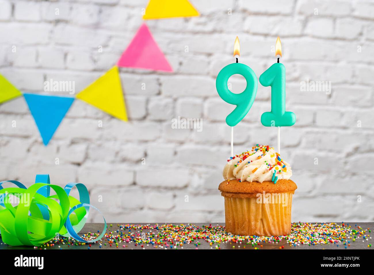 Candle number 91 - Birthday celebration with cupcake Stock Photo - Alamy