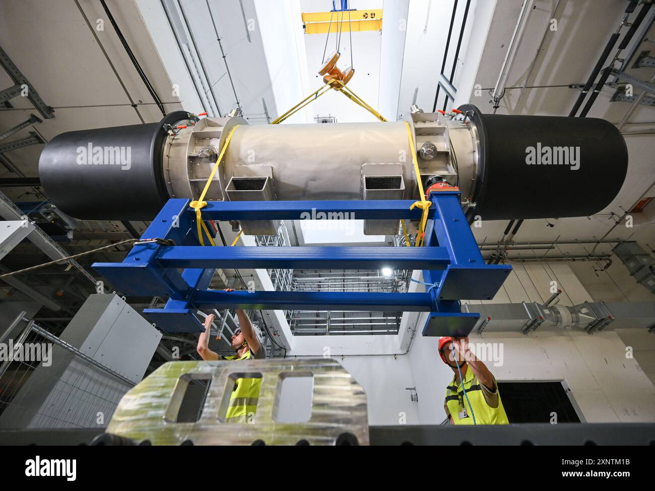 02 August 2024, Hesse, Darmstadt: A dipole magnet weighing several tons ...