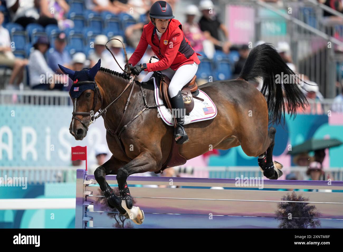 USA's Laura Kraut riding Baloutinue clears a hurdle during the ...