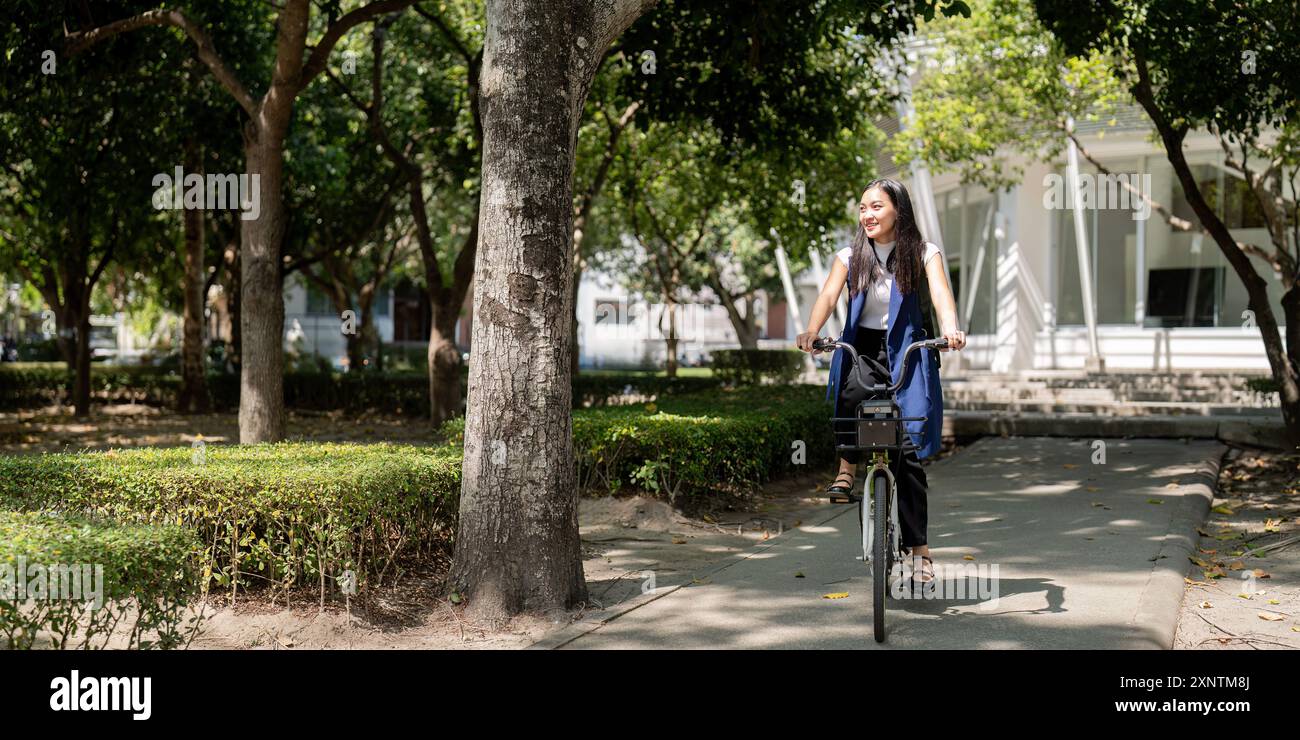 Business Professional Riding Bicycle in Eco Friendly Urban Park ...