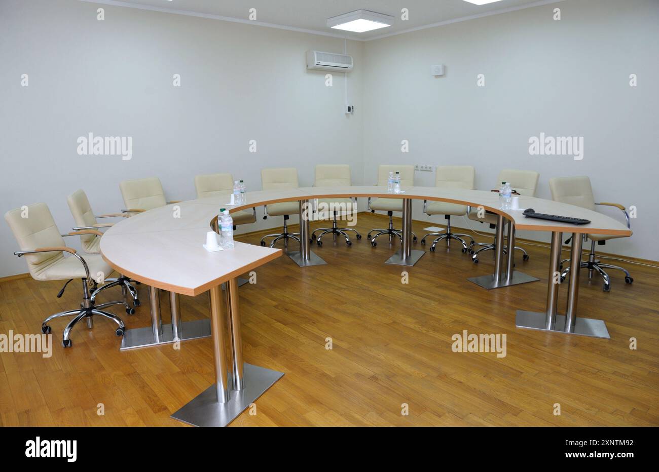 Conference room with a table, chairs and bottles with water set Stock ...