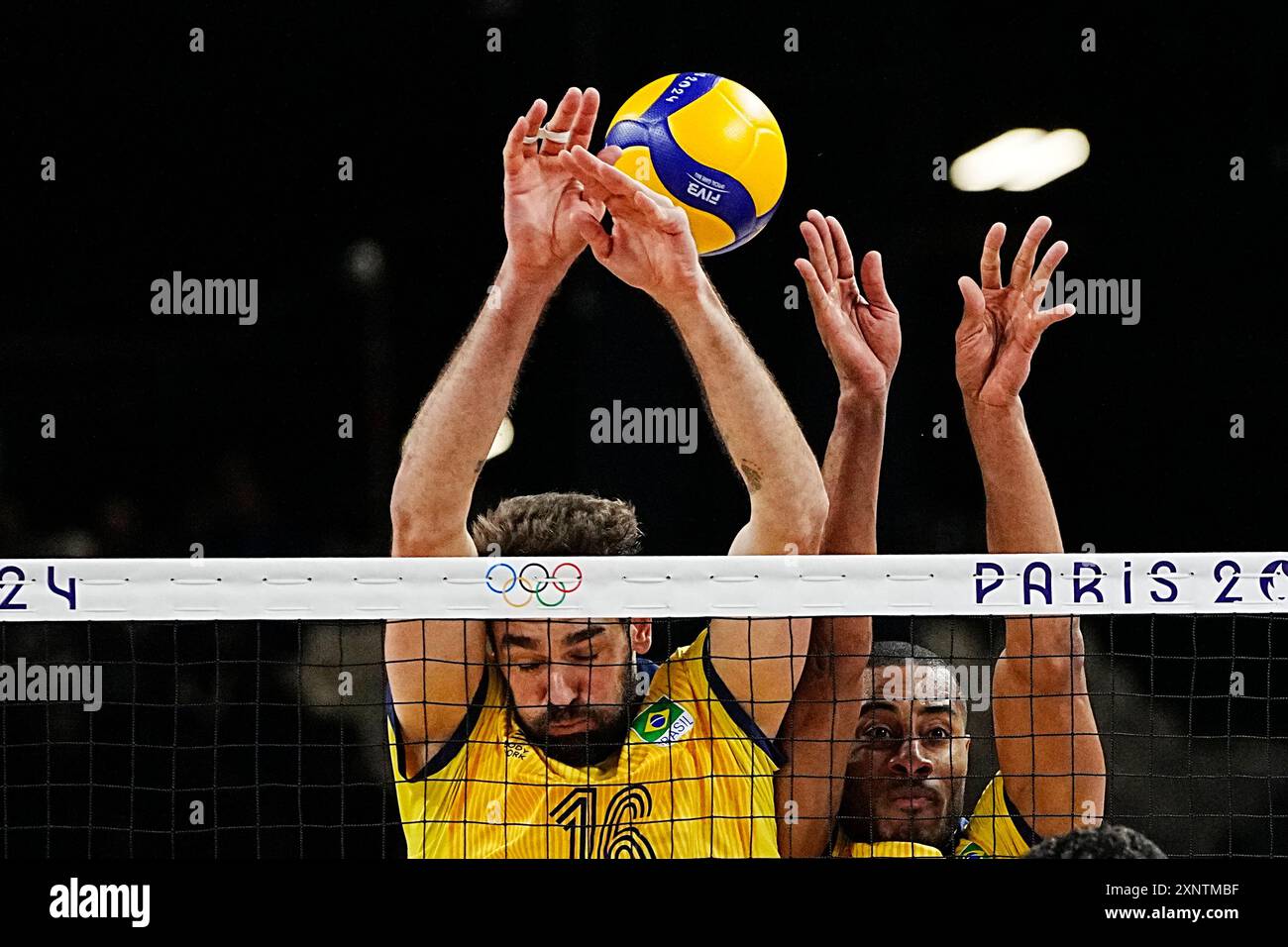 Lucas Saatkamp, left, and Ricardo Lucarelli Souza of Brazil, block the ...