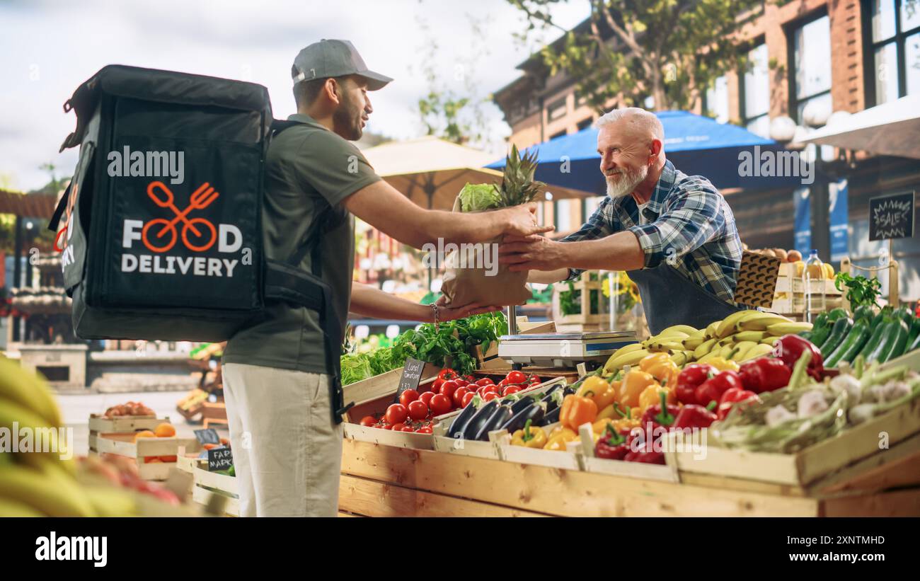 Food Delivery Courier Picking Up an Online Marketplace Order with ...