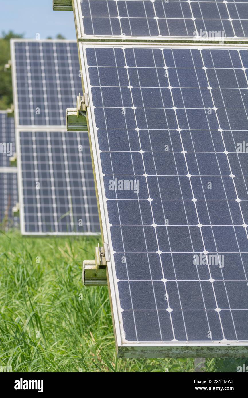 Sections of racked fixed tilt PV / Photo-voltaic solar farm array of ...