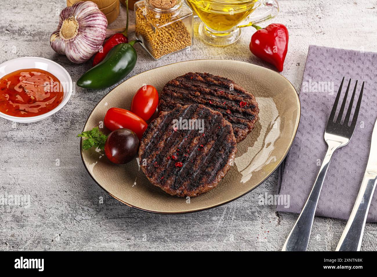 Grilled beef burger cutlet with sauce Stock Photo - Alamy