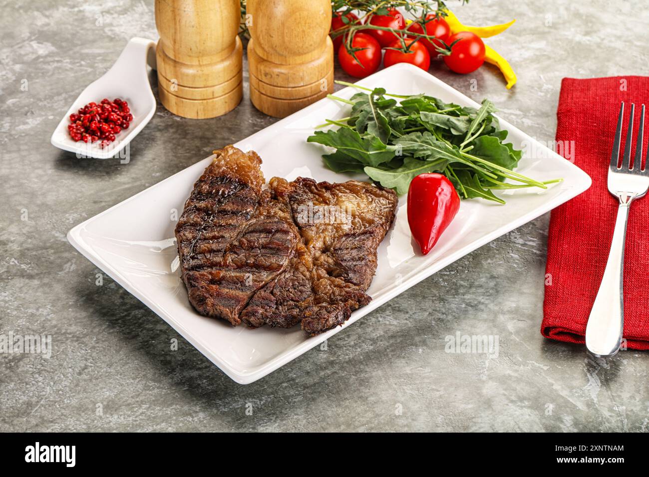 Grilled chuck roll beef steak with arugula Stock Photo - Alamy