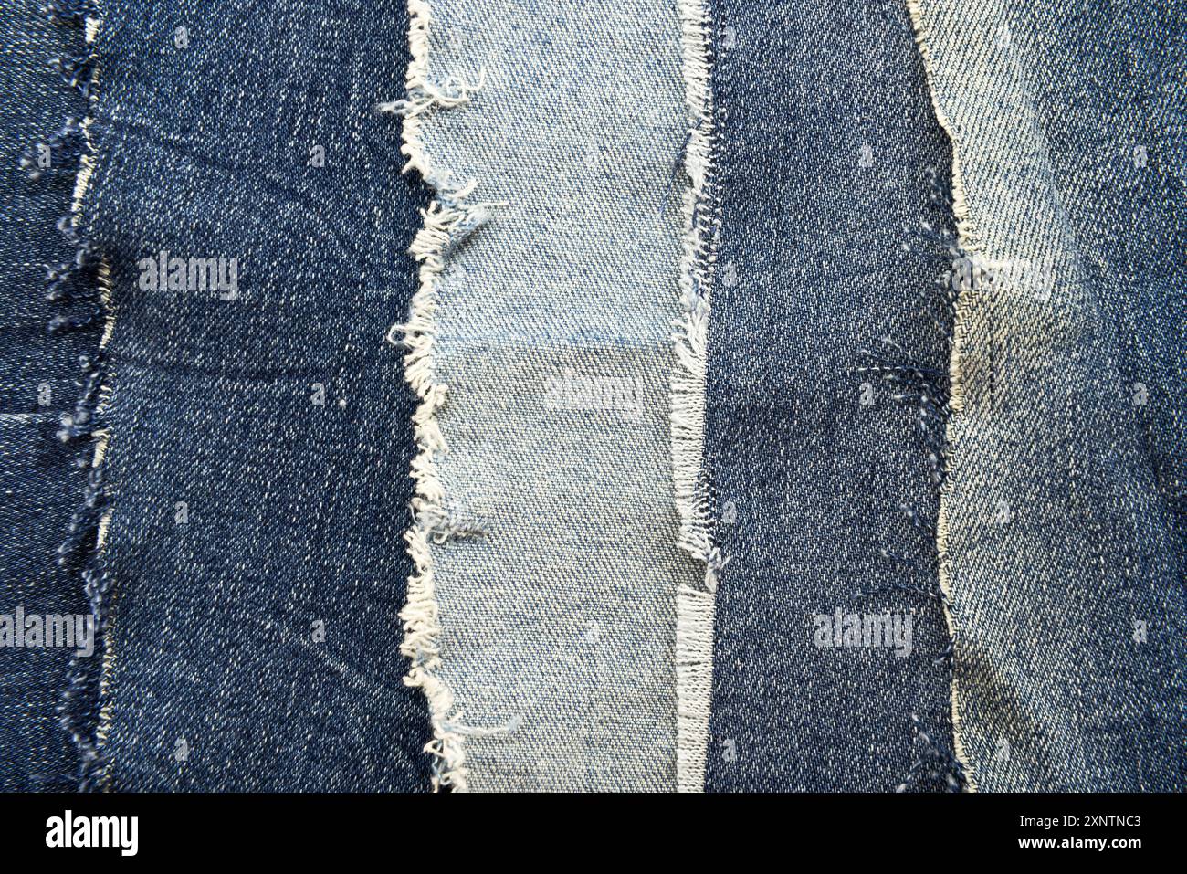 Texture of denim pieces. Background of jeans Stock Photo - Alamy