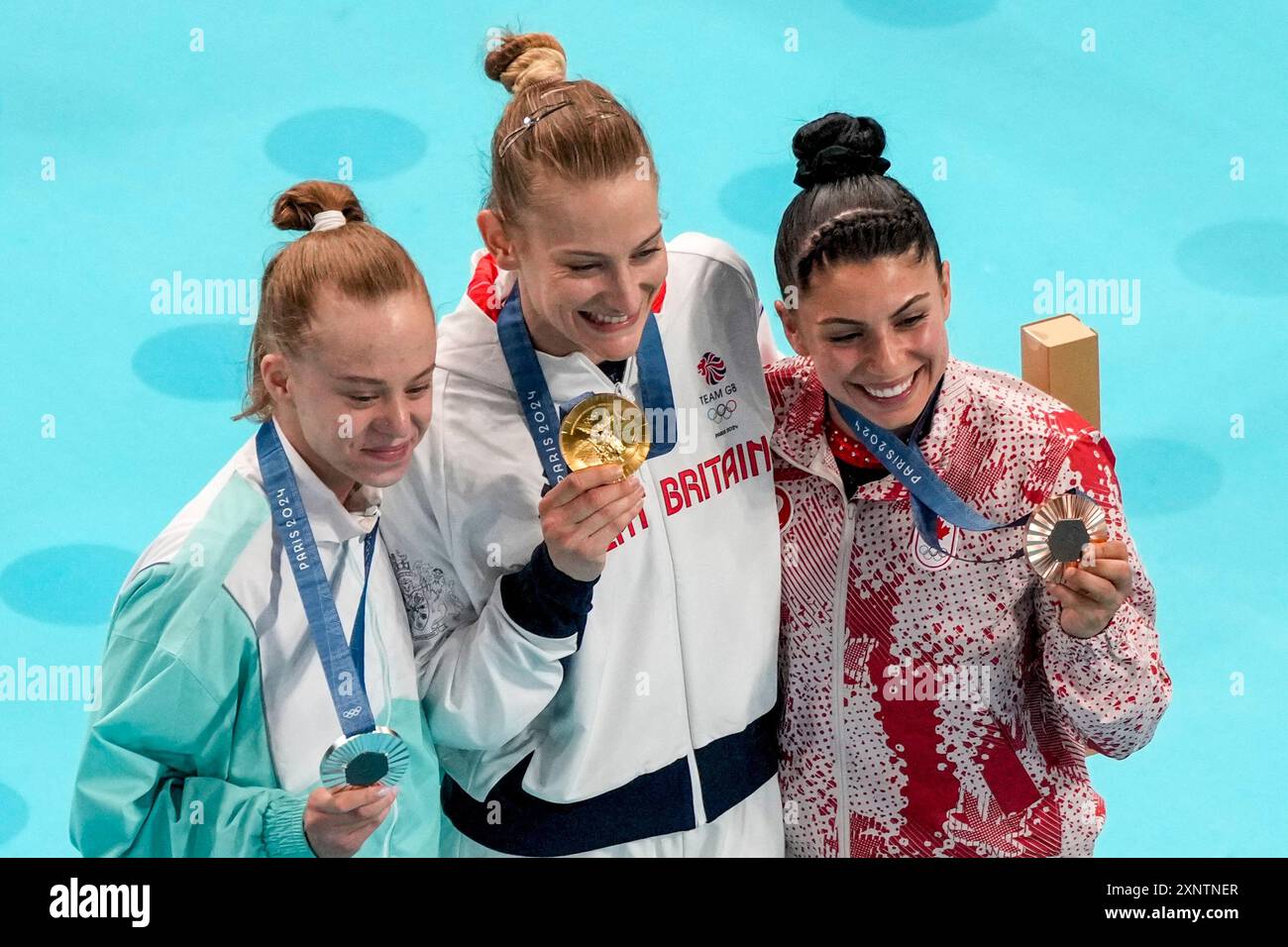 Gold medal winner Bryony Page of Britain is flanked by silver medal ...