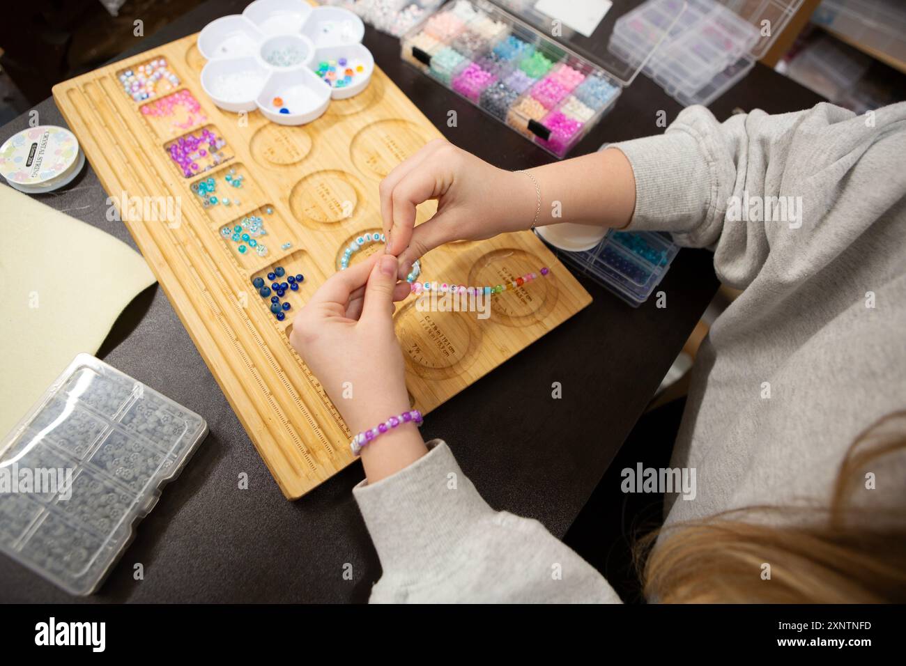 Grace Evans making Taylor Swift bracelets at Make CIC which is a ...