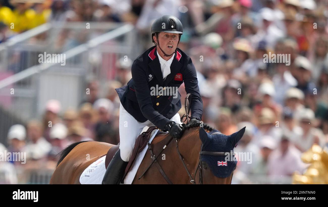 Britain's Ben Maher riding Dallas Vegas Batilly clears a hurdle during ...