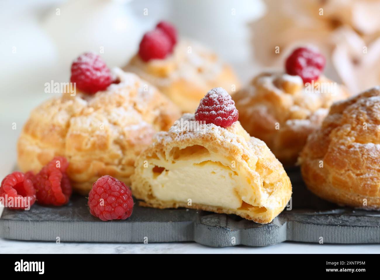 traditional choux pastry eclair dessert on a plate Stock Photo - Alamy