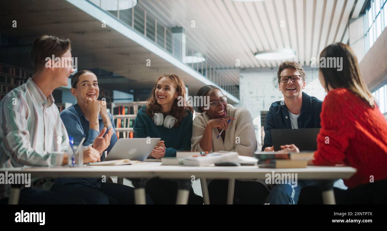Diverse Group of Students Collaborating on a Project in a Modern ...