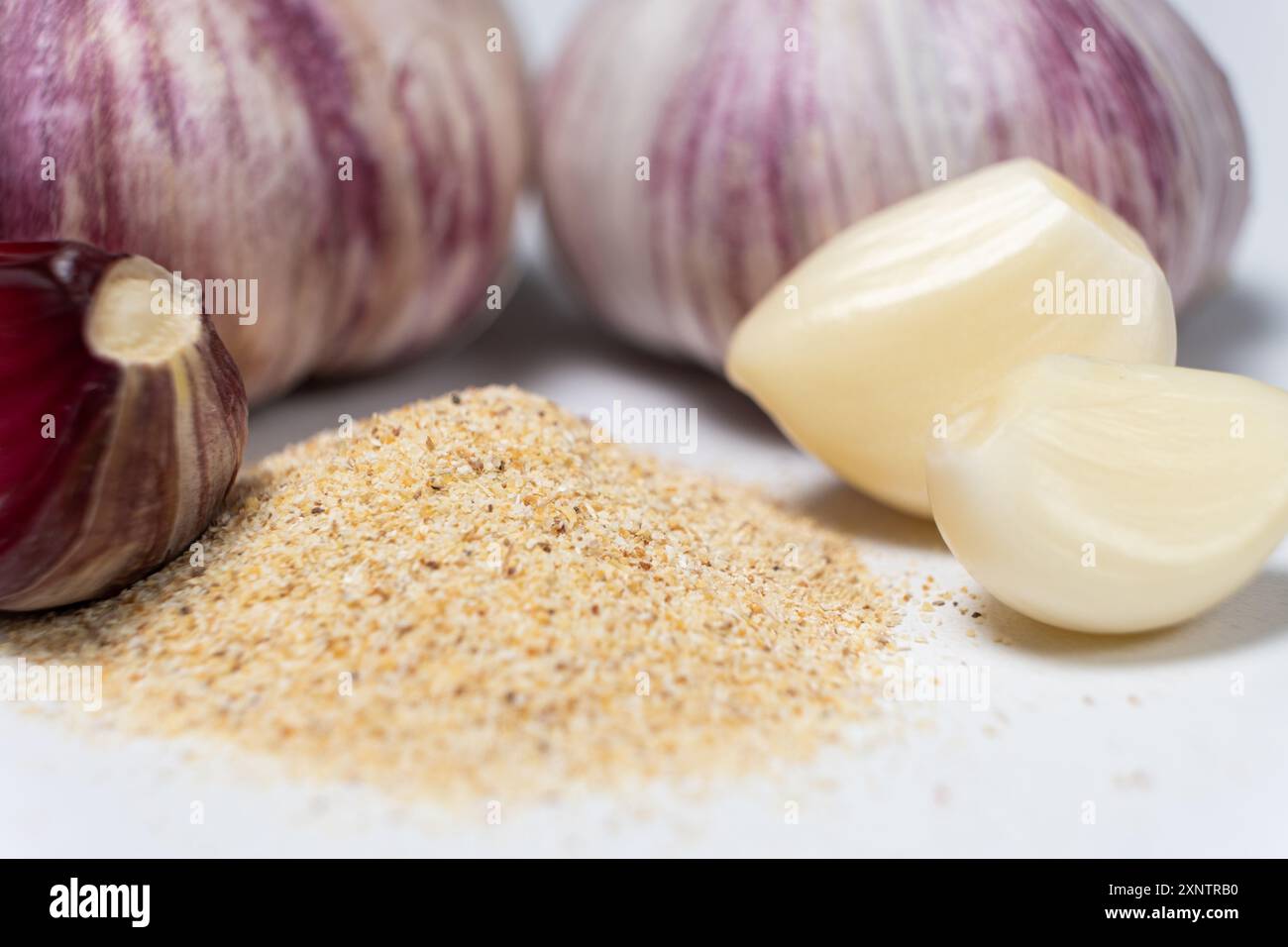 Ground dried garlic powder, natural spice, white background Stock Photo ...