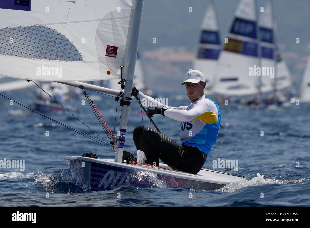 Matthew Wearn of Australia crosses the finish line to win a men's ...