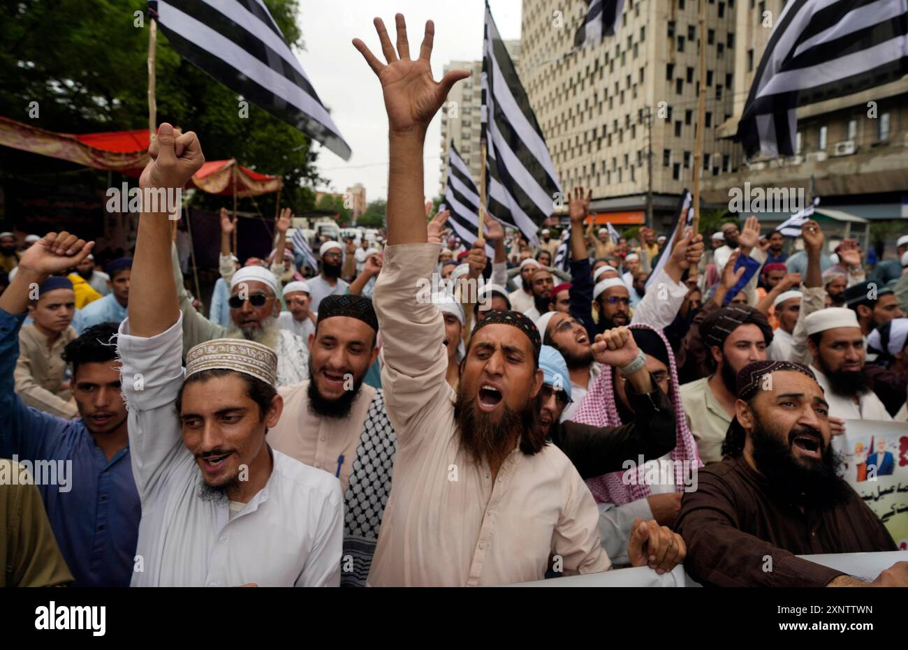Supporters of political party Jamiat Ulema-e-Islam, chant slogans ...
