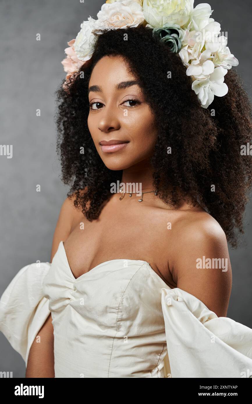A beautiful African American bride in a white wedding dress with ...
