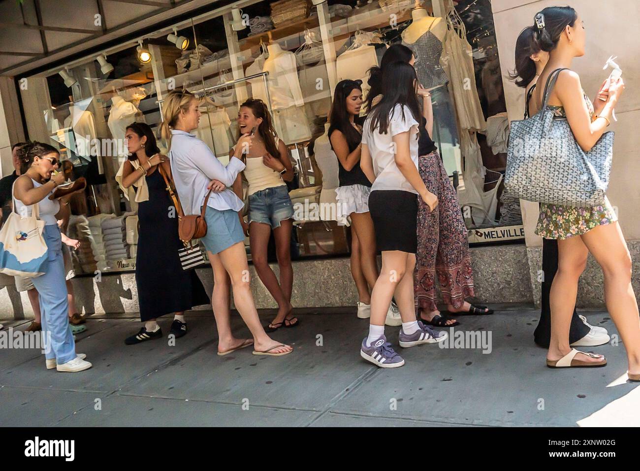 Customers line up to enter the Brandy Melville store in Greenwich ...