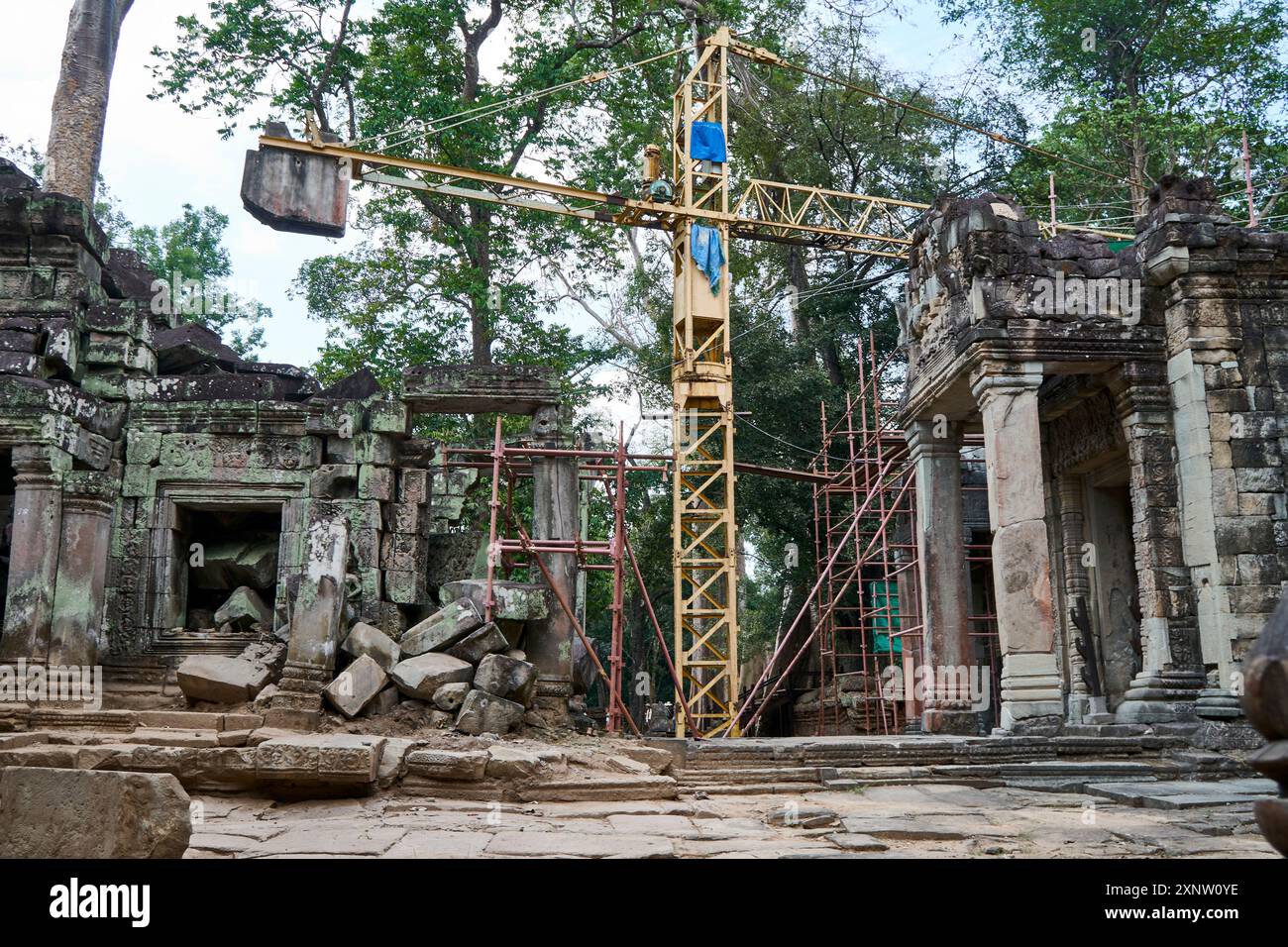 Ancient stone ruins of Angkor Thom in Cambodia undergoing restoration ...