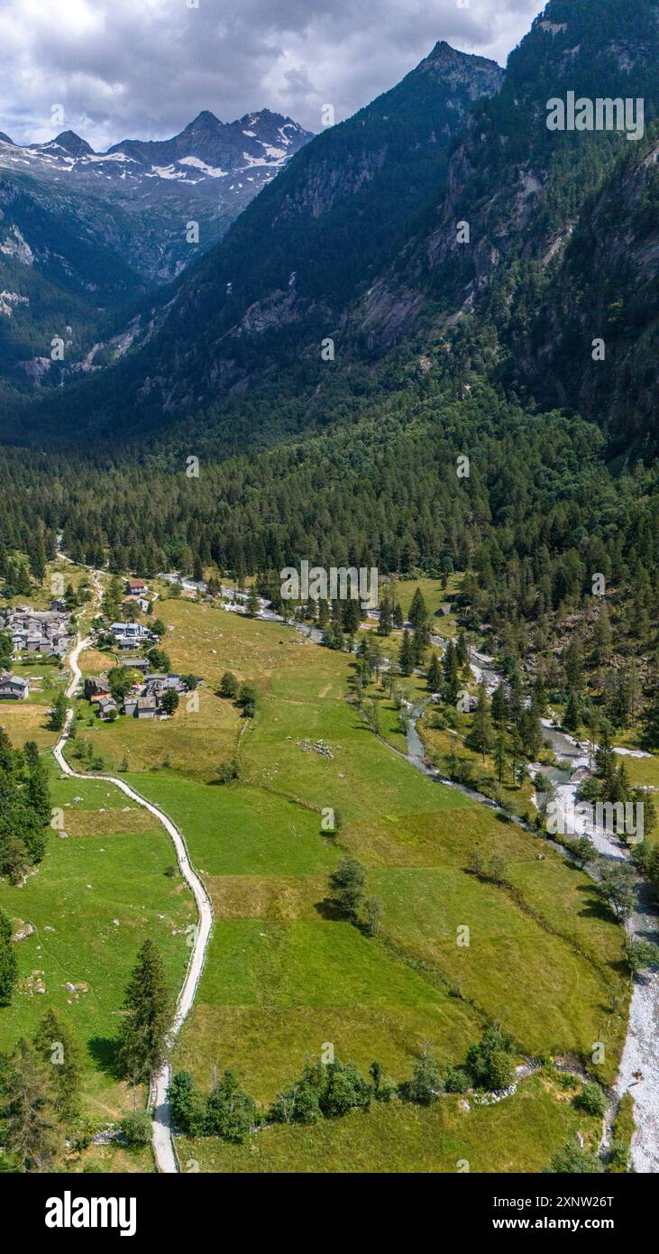 Aerial view of Val di Mello, a green valley surrounded by granite ...
