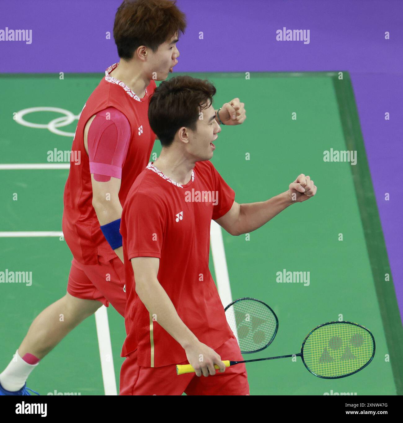 Paris, France. 2nd Aug, 2024. Liang Weikeng/Wang Chang (front) of China celebrate scoring during ...