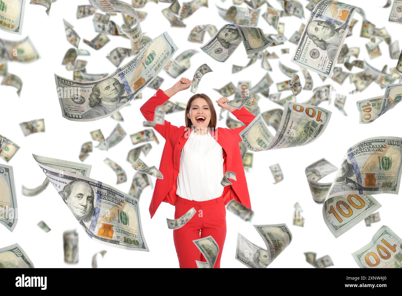 Happy businesswoman under money rain on white background Stock Photo ...