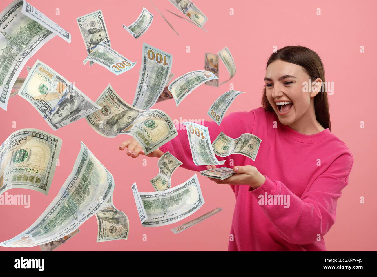 Woman and flying dollar bills hi-res stock photography and images - Alamy