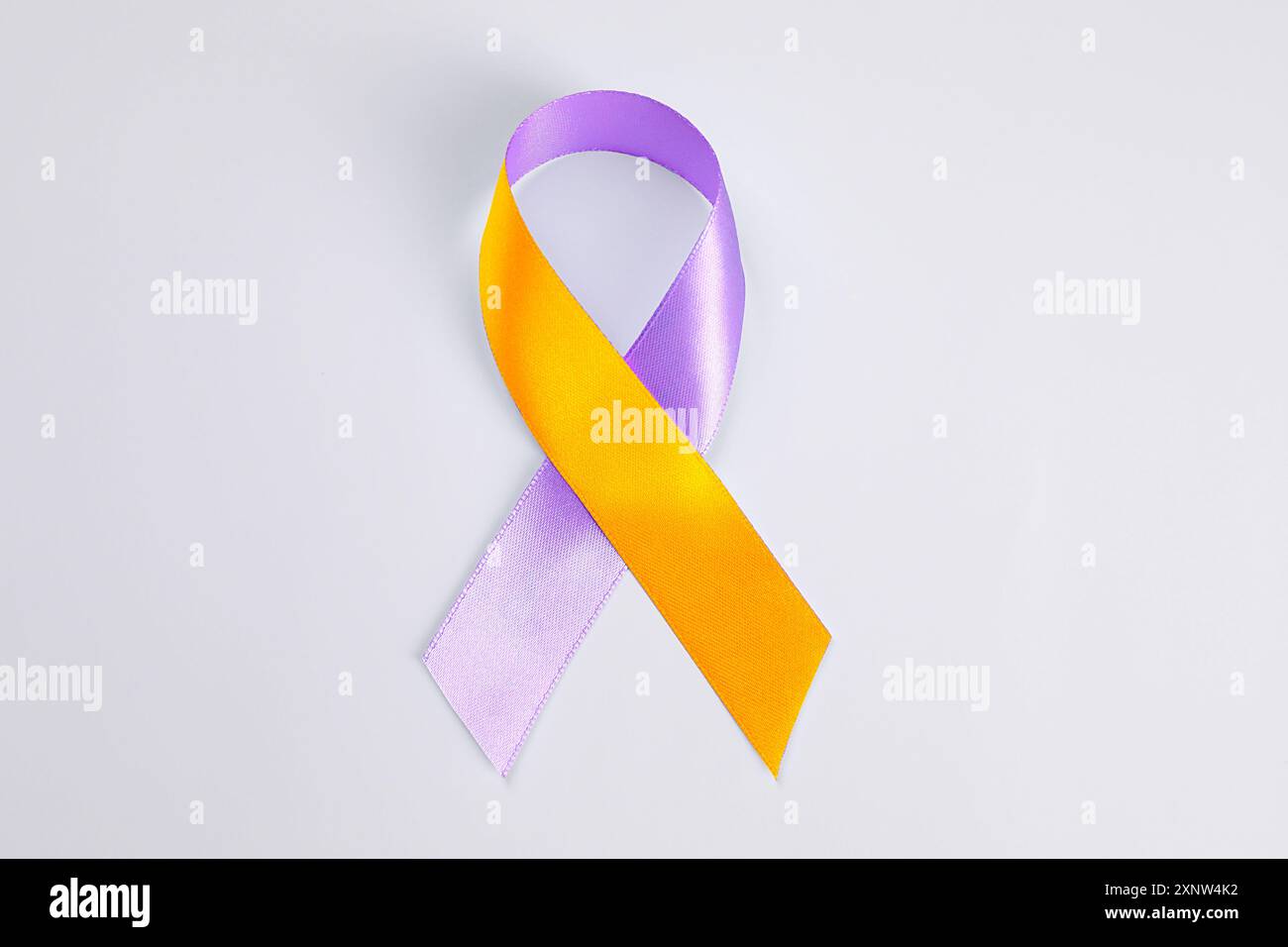 World Psoriasis Day. Orange and orchid awareness ribbon as symbol of ...