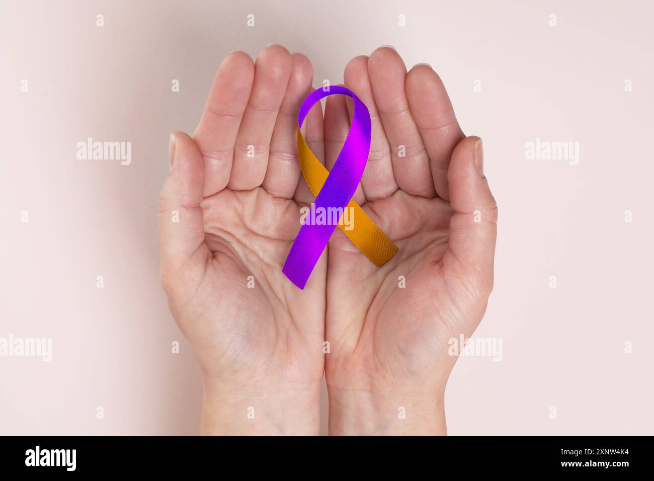 World Psoriasis Day. Woman with orange and orchid ribbon as symbol of ...