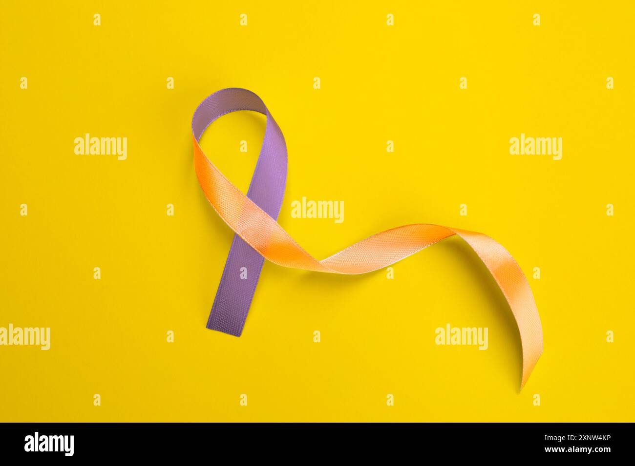 World Psoriasis Day. Orange and orchid awareness ribbon as symbol of ...