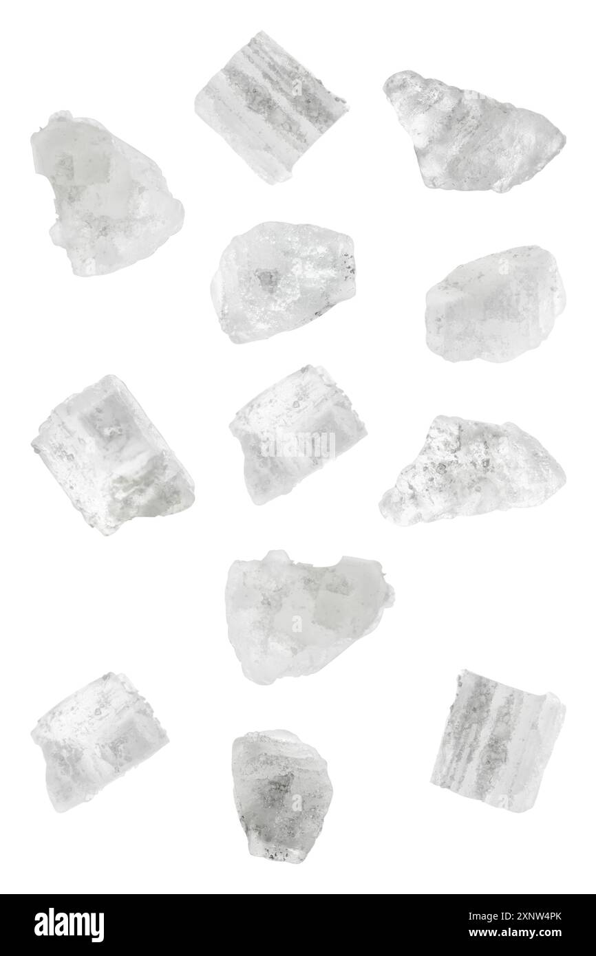 Sea salt crystals in air on white background Stock Photo - Alamy