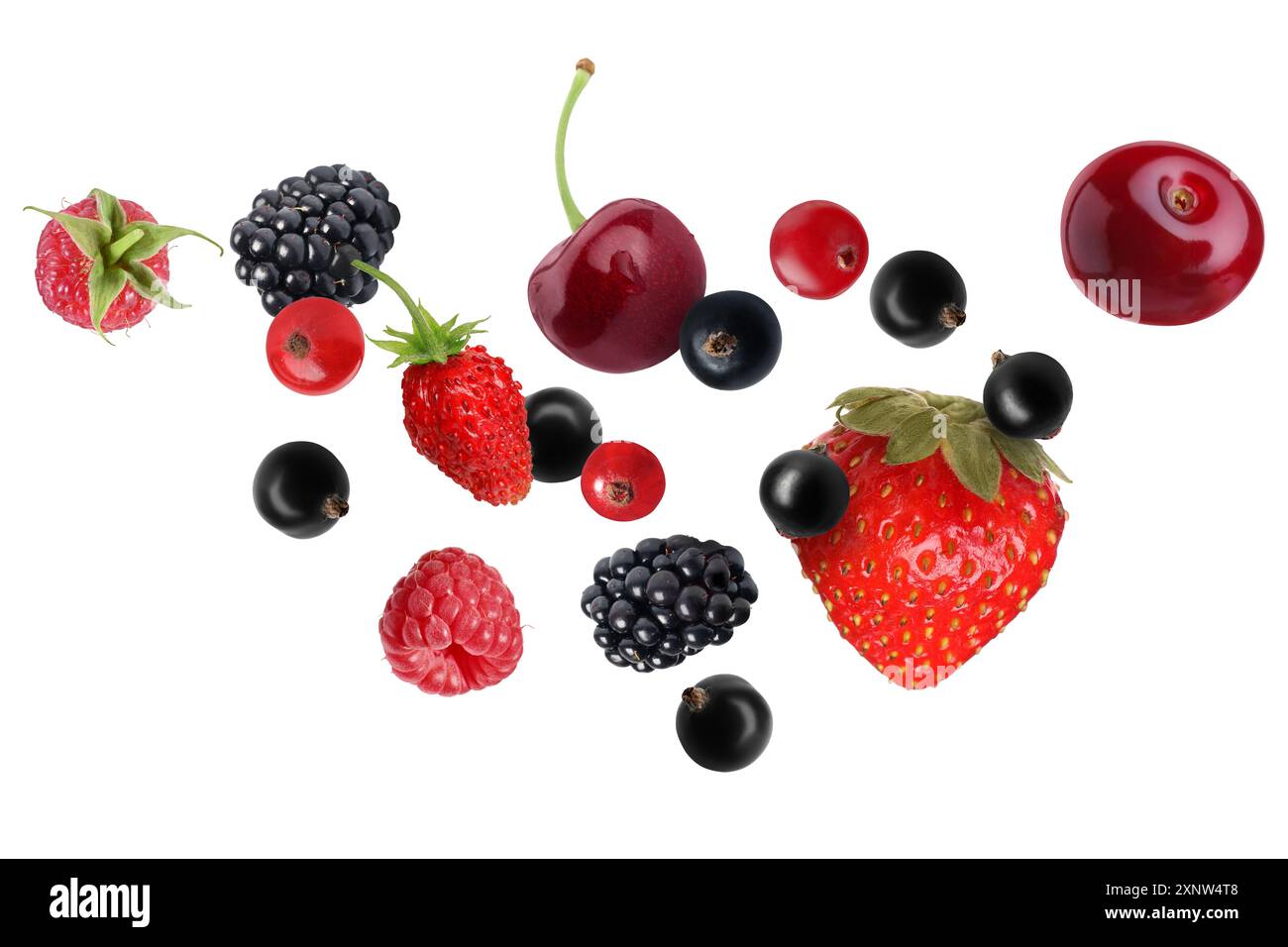 Different fresh berries in air on white background Stock Photo - Alamy