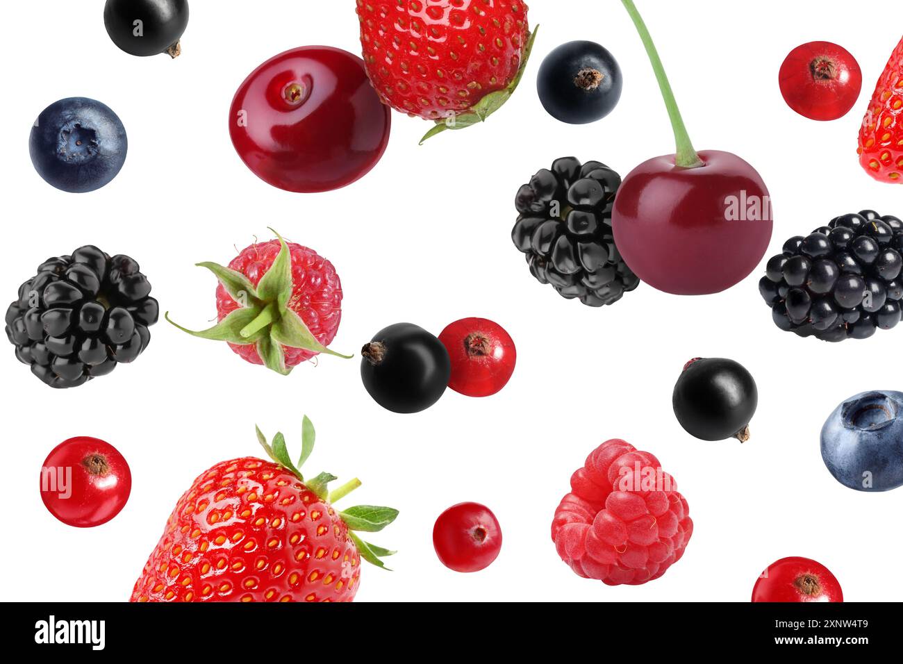 Different fresh berries in air on white background Stock Photo - Alamy