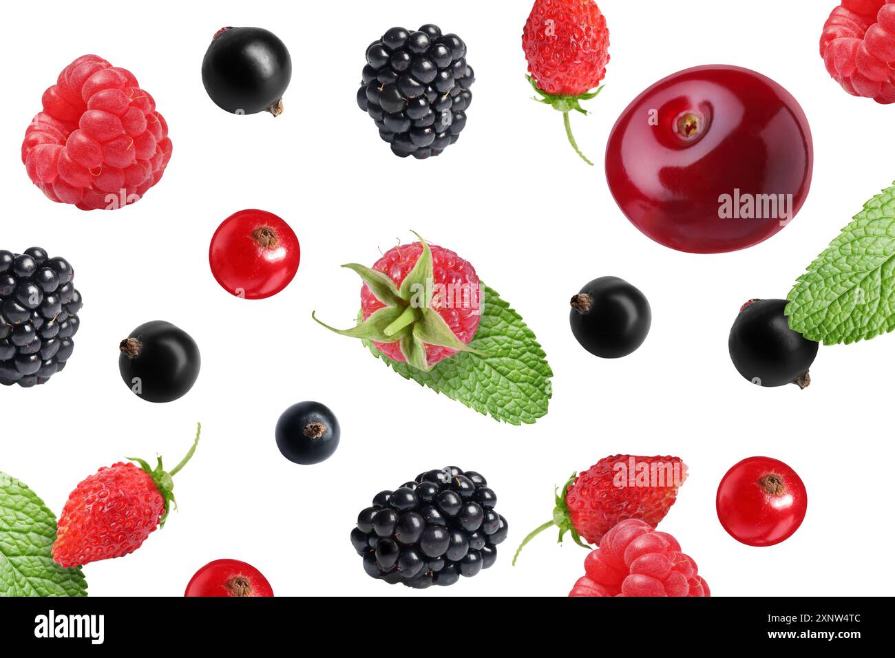 Different fresh berries in air on white background Stock Photo - Alamy